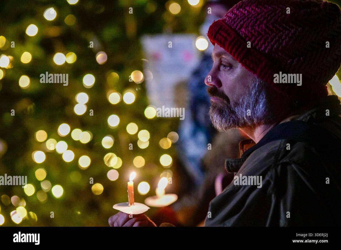 People gather at Pliny Park in Brattleboro, Vt., for a candlelight ...