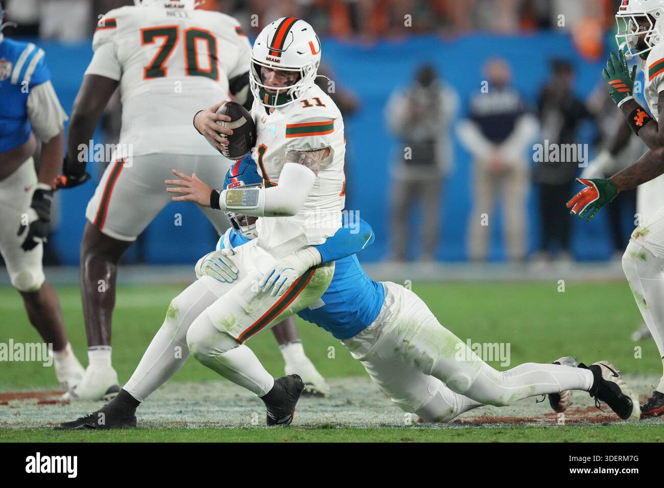 Miami quarterback Carson Beck (11) is sacked by Mississippi linebacker ...