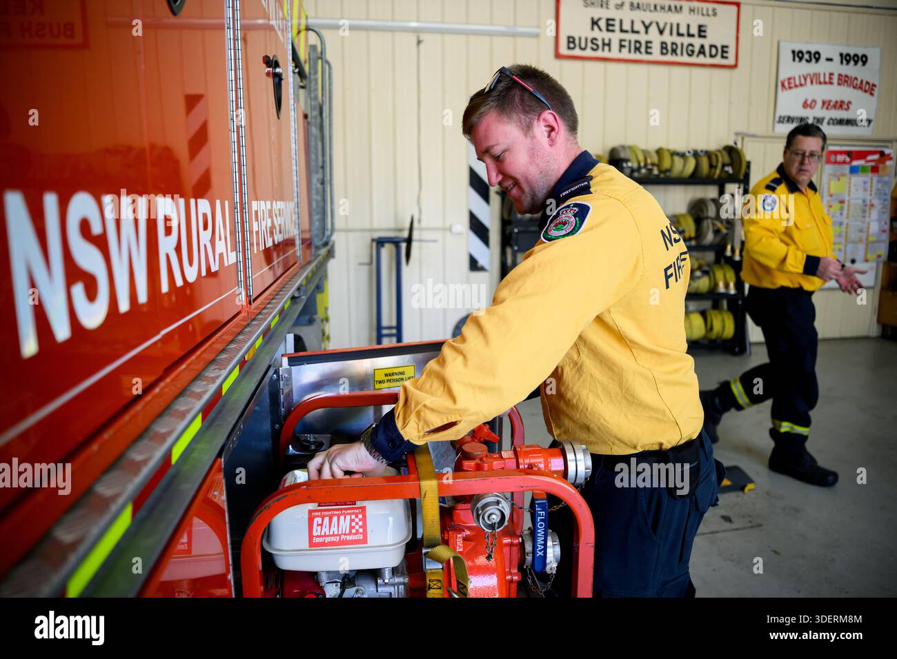 Members of the Rural Fire Service (RFS) prepare a category one tanker ...