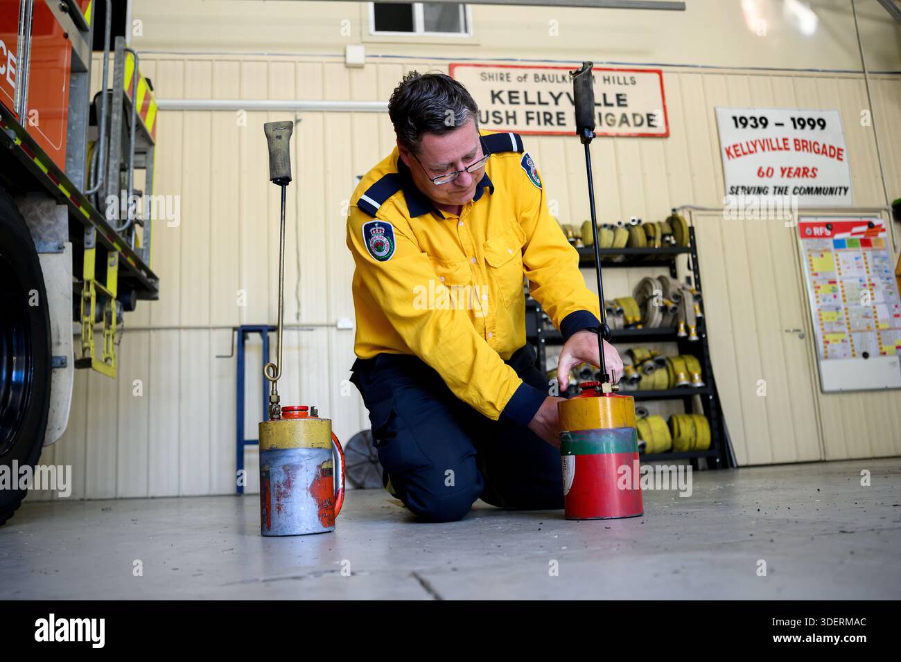 Members of the Rural Fire Service (RFS) prepare a category one tanker ...