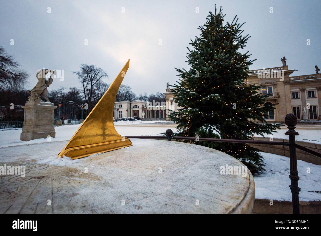 A Christmas tree is seen behind the park's sundial. Photographs of ...