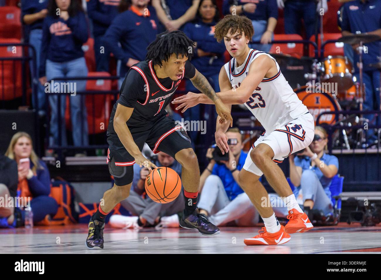 Rutgers' Jamichael Davis drives for position as Illinois' Keaton Wagler ...