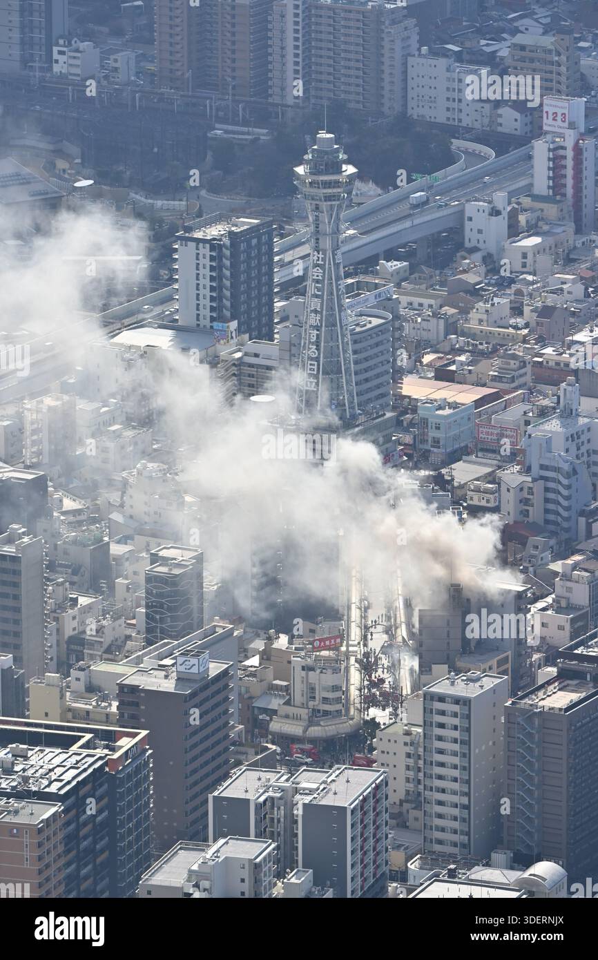 An aerial photo shows a fire scene billowing white smoke in Naniwa Ward ...