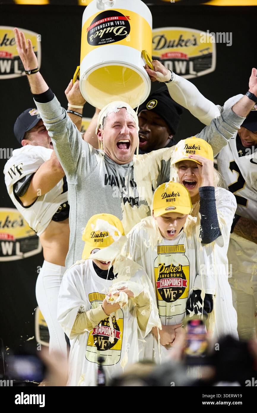Wake Forest head coach Jake Dickert and his children, Rylee, Jace and ...