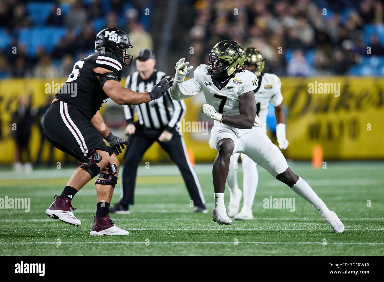 Wake Forest defensive lineman Nuer Gatkuoth (7) tries to get through ...