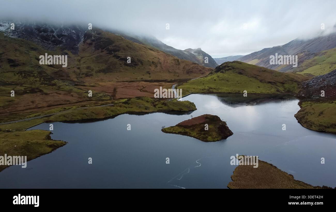 Aerial view of Llyn y Dywarchen with the mist-covered summit of Y Garn ...