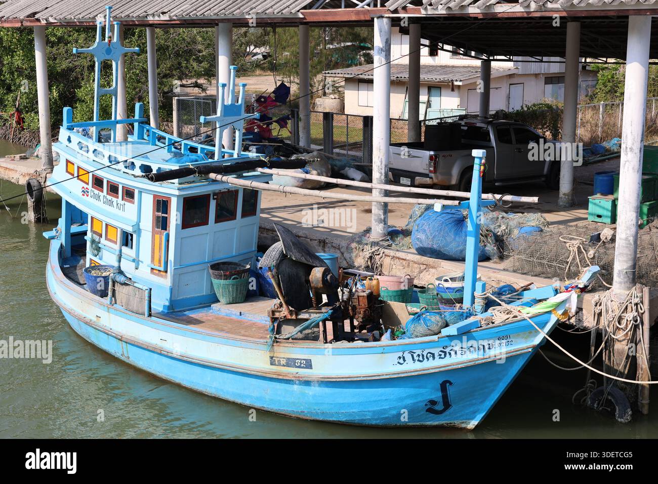 A traditional fishing boat is berthed in an estuary in Sam Roi Yot ...