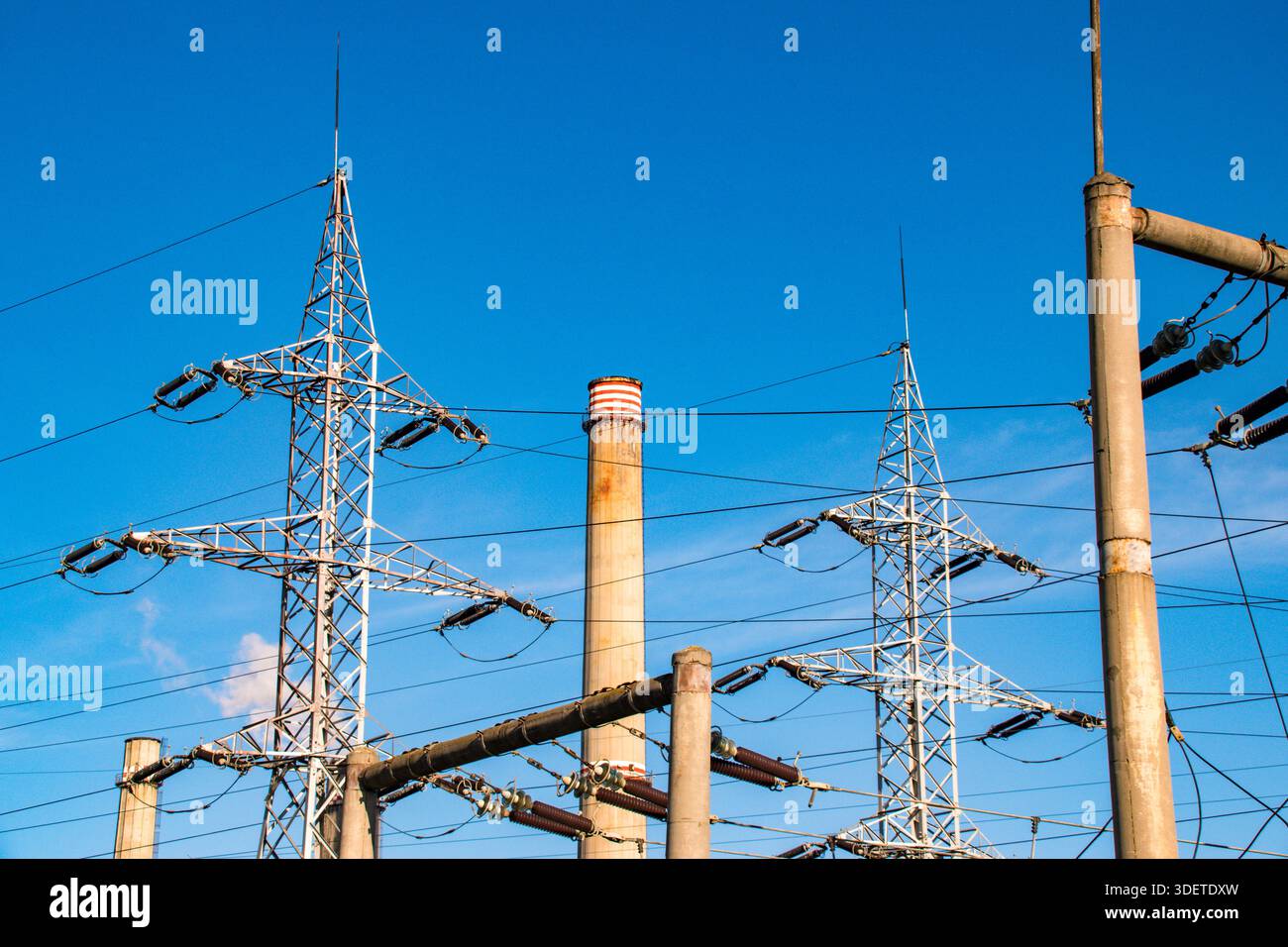 High-voltage poles are massive metal structures, essential for ...