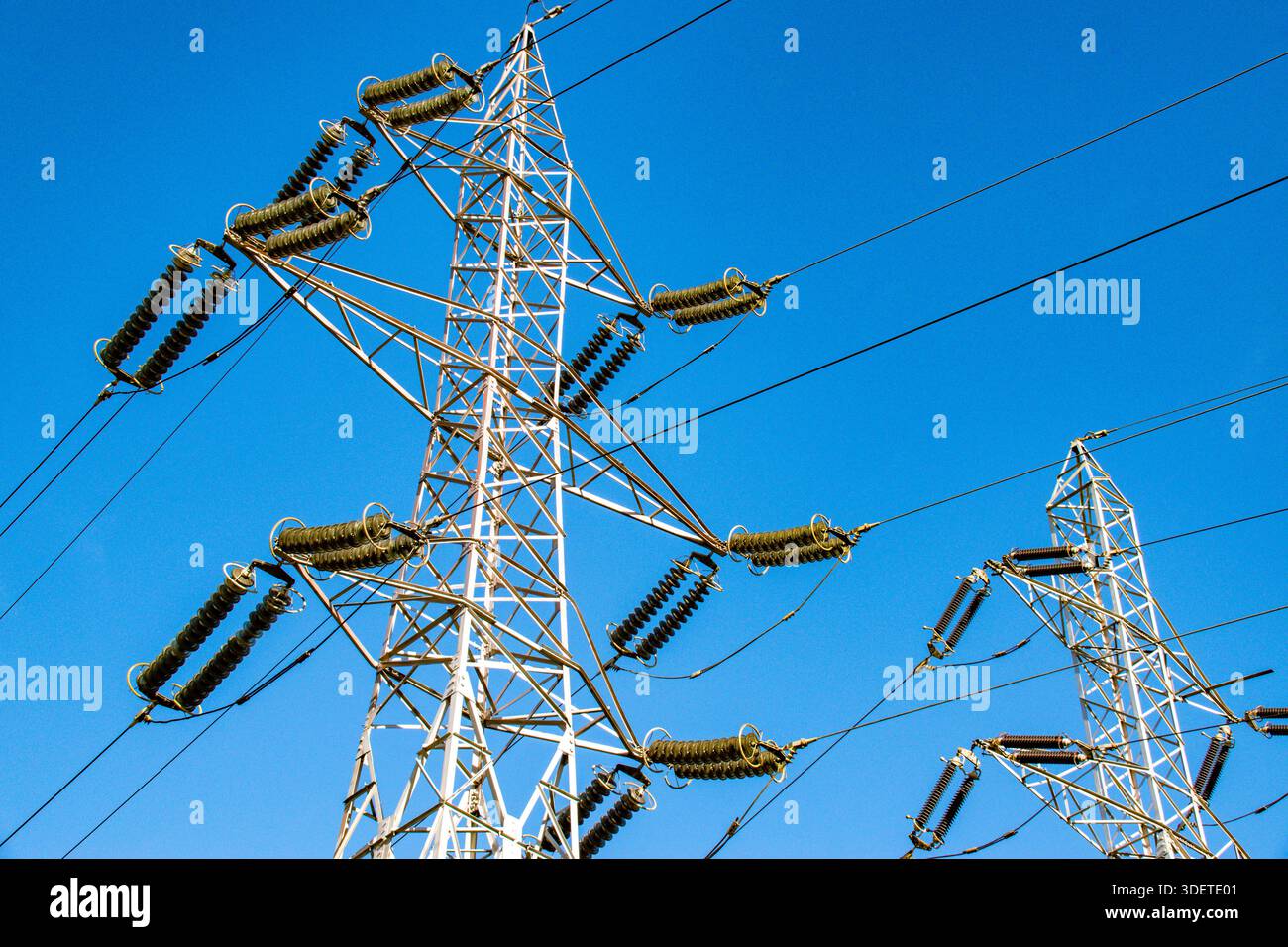 High-voltage poles are massive metal structures, essential for ...