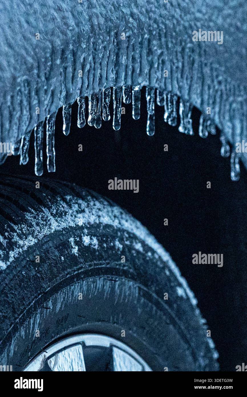 09 January 2026, Bavaria, Straubing: Icicles hanging from the wheel ...