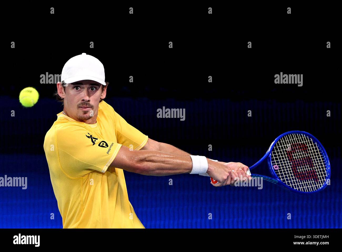 Alex de Minaur of Australia plays a return shot during the quarterfinal ...