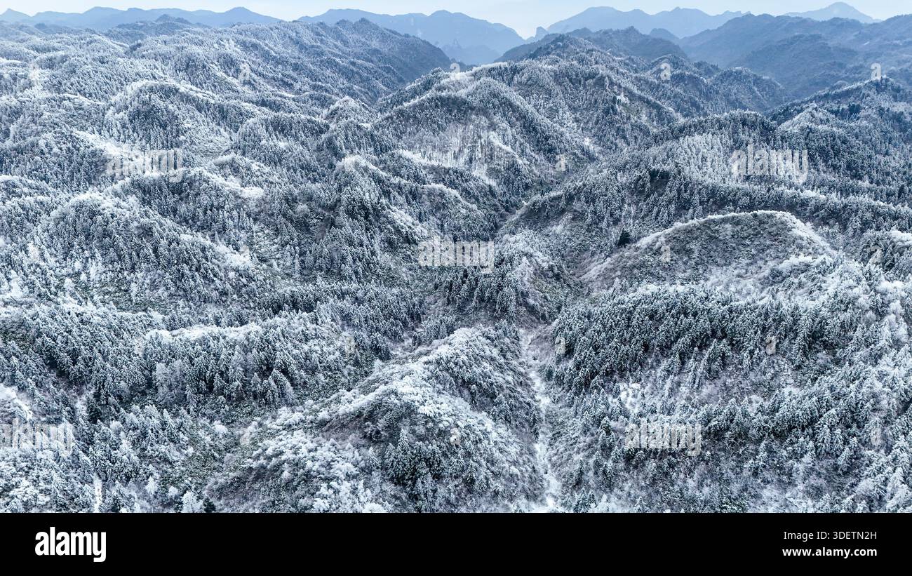Aerial photo shows the snow-covered landscape in Youyang County ...