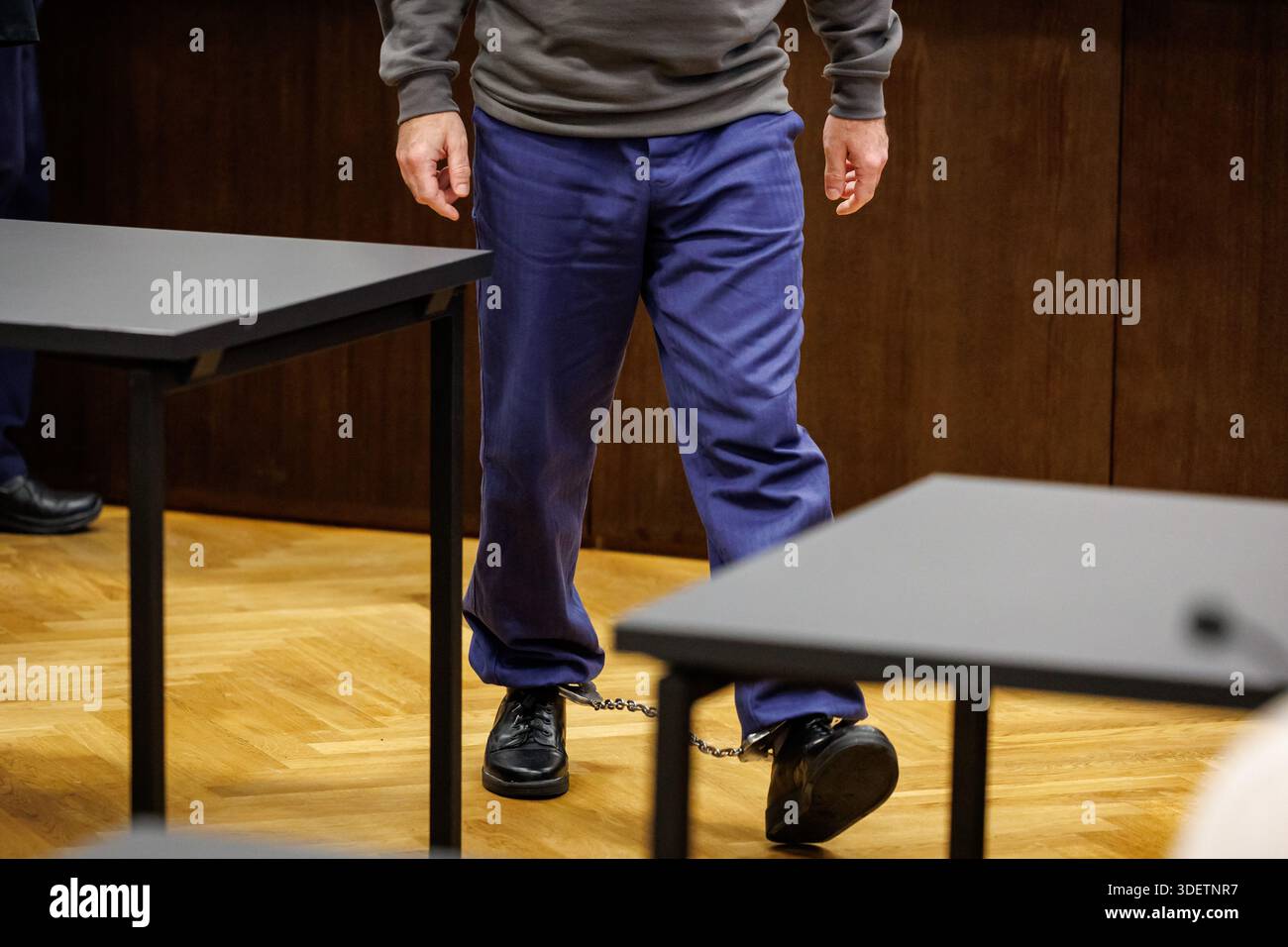 09 January 2026, Bavaria, Nuremberg: A defendant arrives in shackles at ...