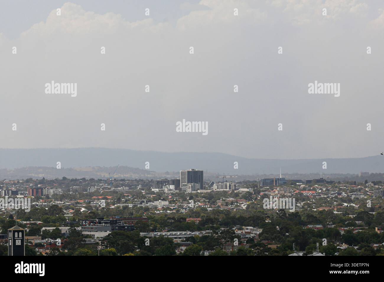 A general view of the city with smoke from a bushfire visible in the ...