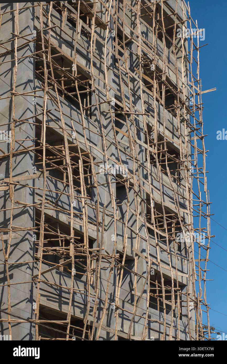 A powerful image of local ingenuity: simple wooden scaffolding is in ...