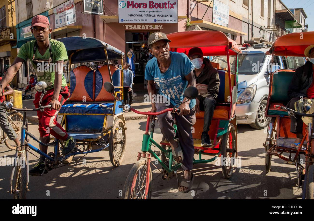 A group of cycle rickshaw drivers and their colorful cycle rickshaws ...