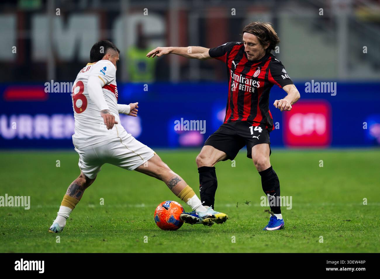 Luka Modric of AC Milan competes for the ball with Nicolae Stanciu of ...