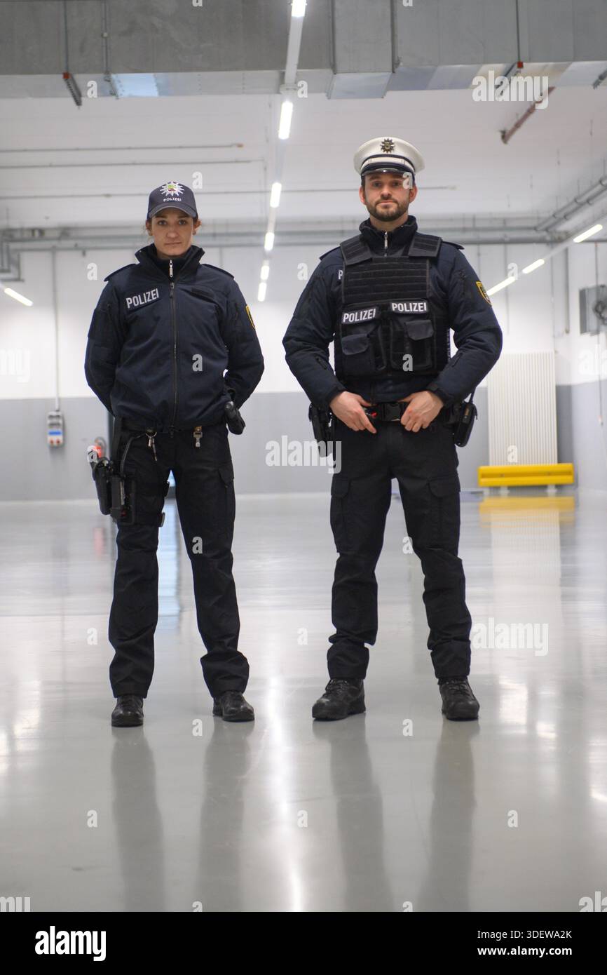 09 January 2026, Saxony-Anhalt, Magdeburg: A policewoman and a police ...