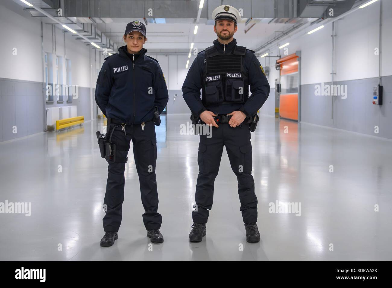 09 January 2026, Saxony-Anhalt, Magdeburg: A policewoman and a police ...