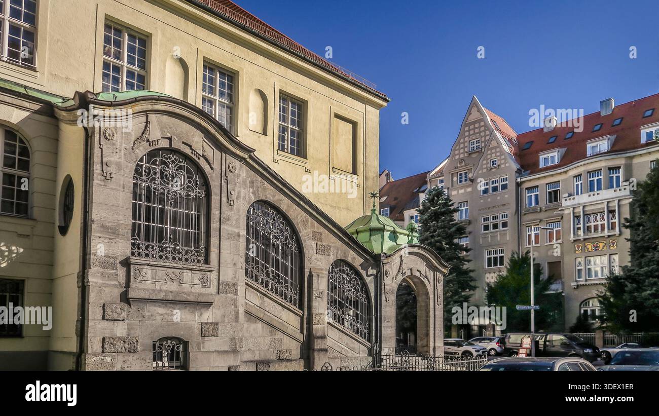Street in Bogenhausen in Munich. On the left a property with baroque ...