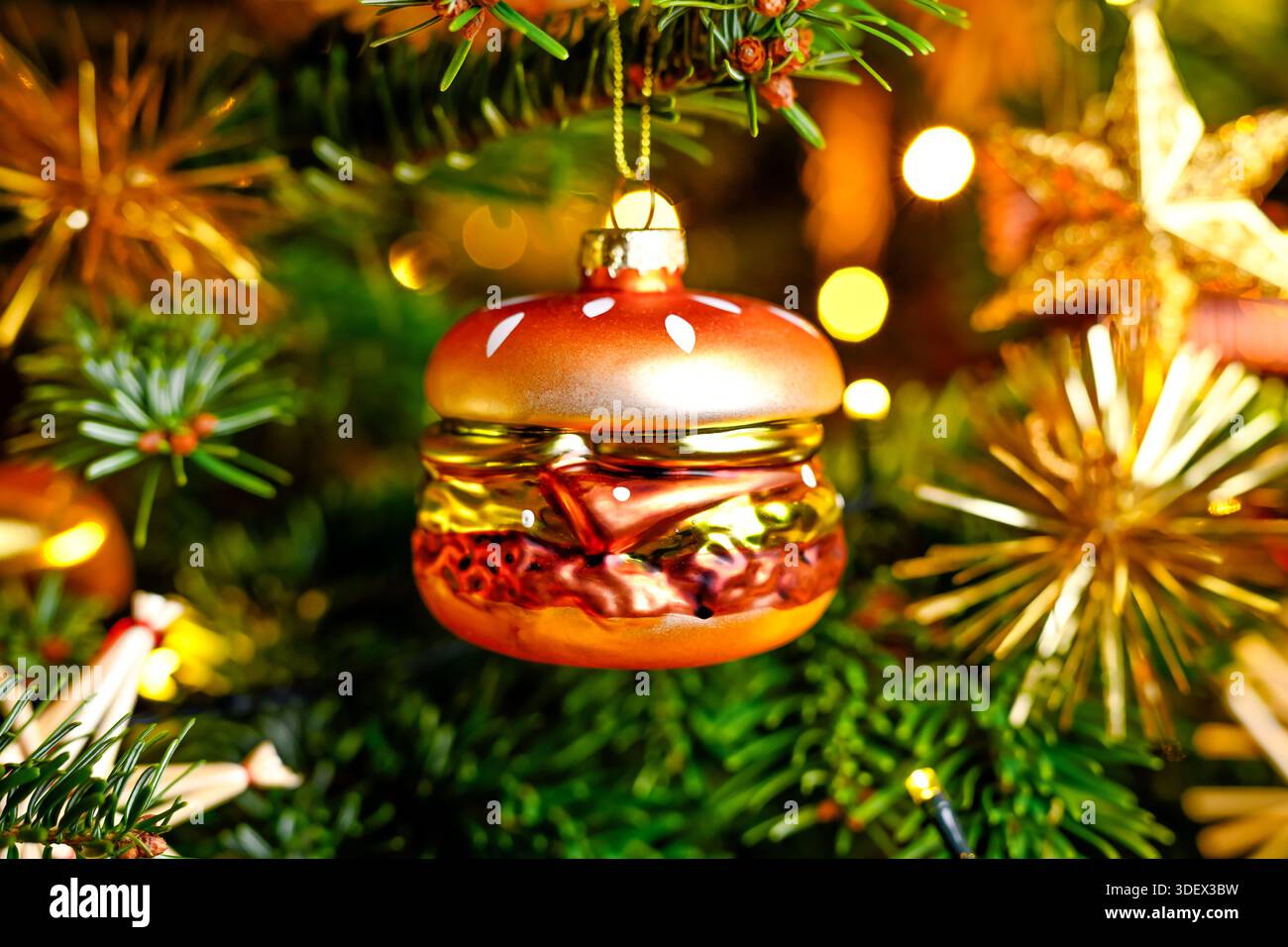 Christmas bauble in the shape of a hamburger hanging on a Christmas ...