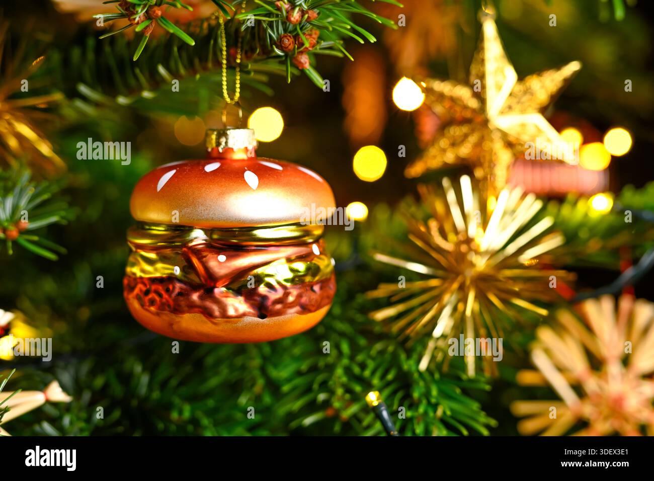 Christmas bauble in the shape of a hamburger hanging on a Christmas ...