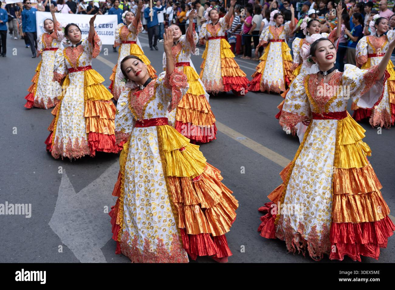 Dancers in traditional costume perform in a Sinulog Festival street ...