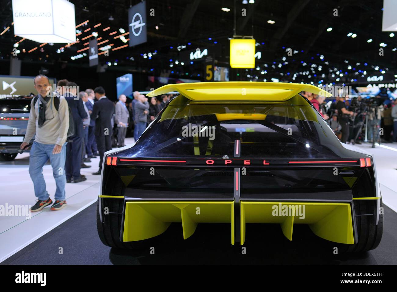 A man walks by the new Opel Corsa GS during the media opening of the ...