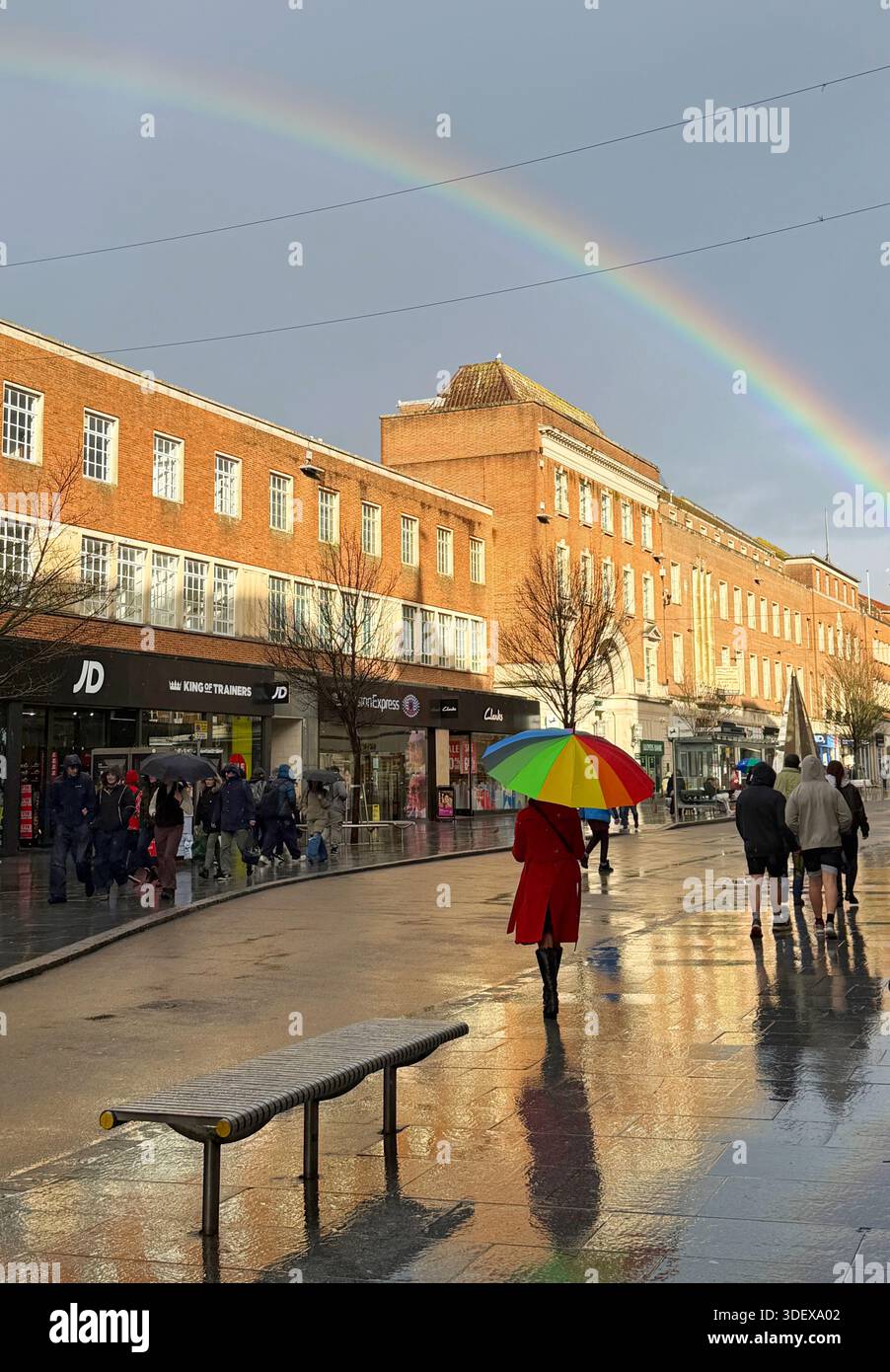 Exeter, Devon, UK. 9 Jan, 2026. UK Weather: Rainbow over High Street, Exeter, Devon. Credit ...