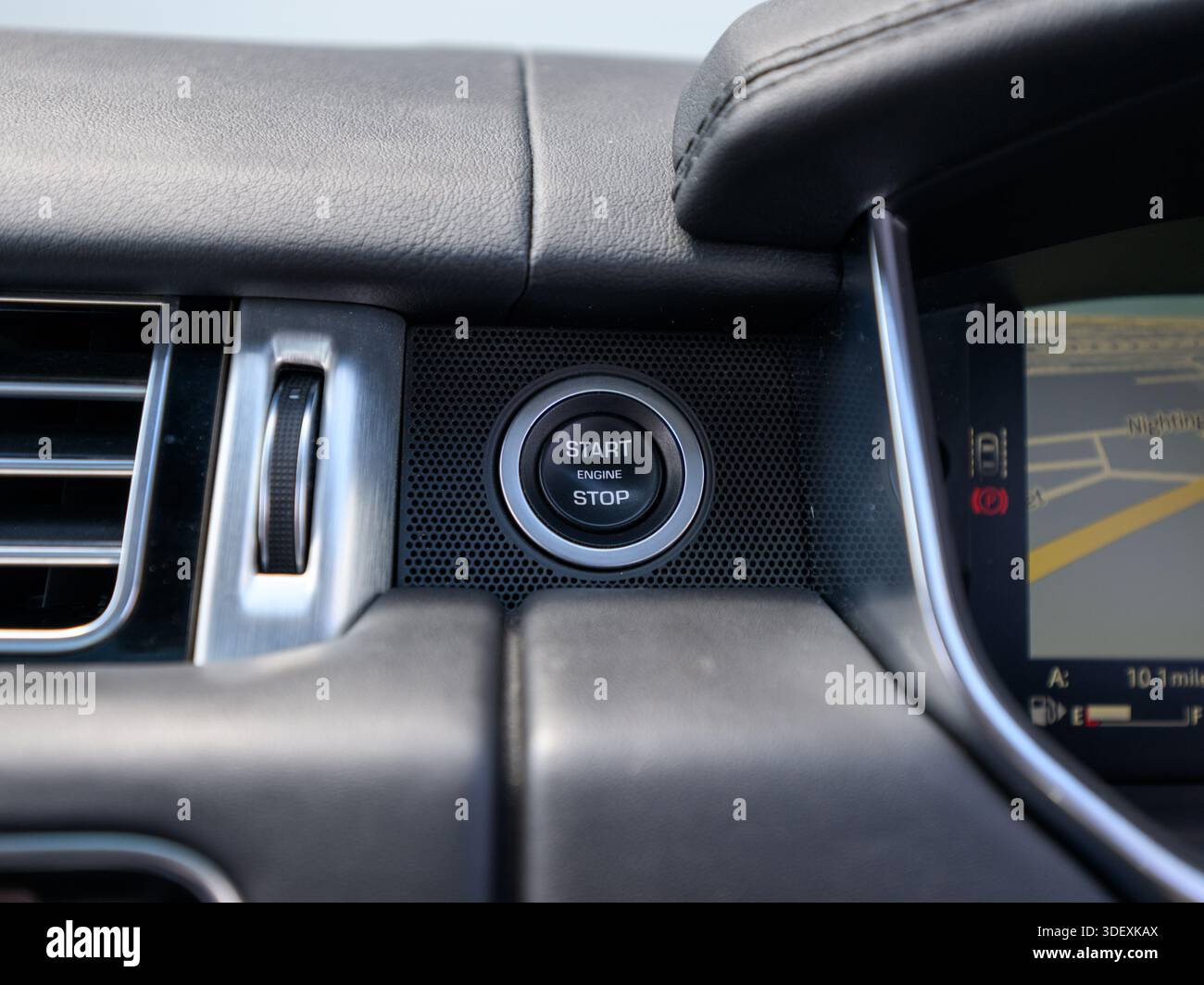 A close up view of a car ignition start stop button on a modern ...