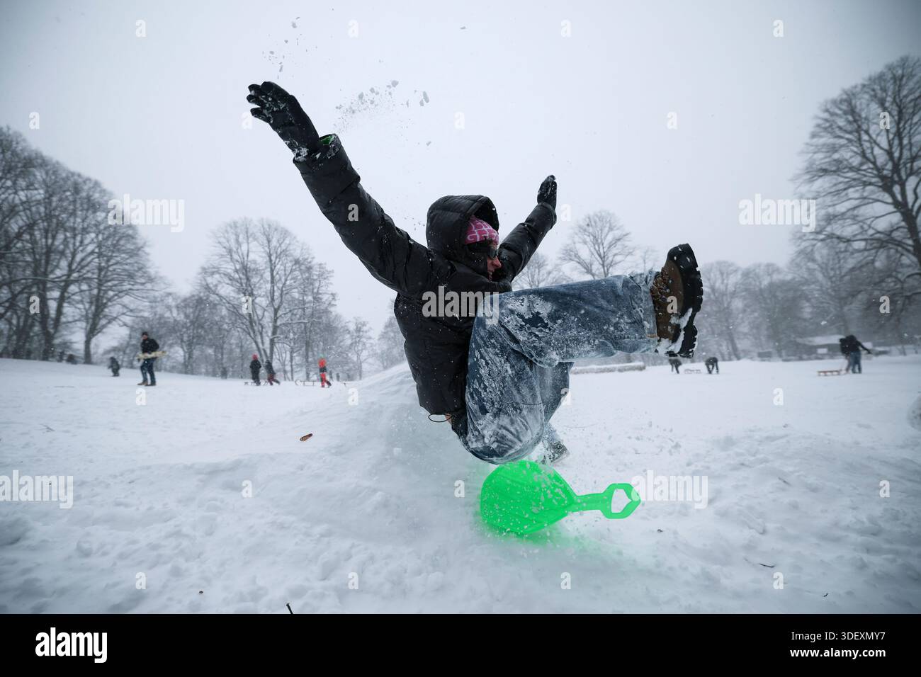 09 January 2026, Hamburg: A young man flies over a small ski jump in ...