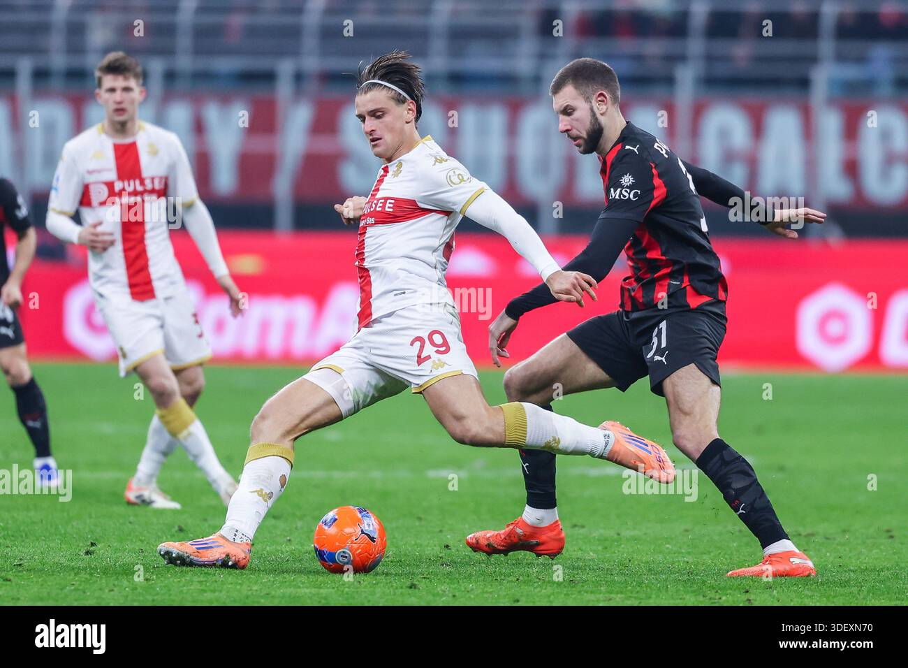 (L-R) Lorenzo Colombo of Genoa CFC competes for the ball with Strahinja ...