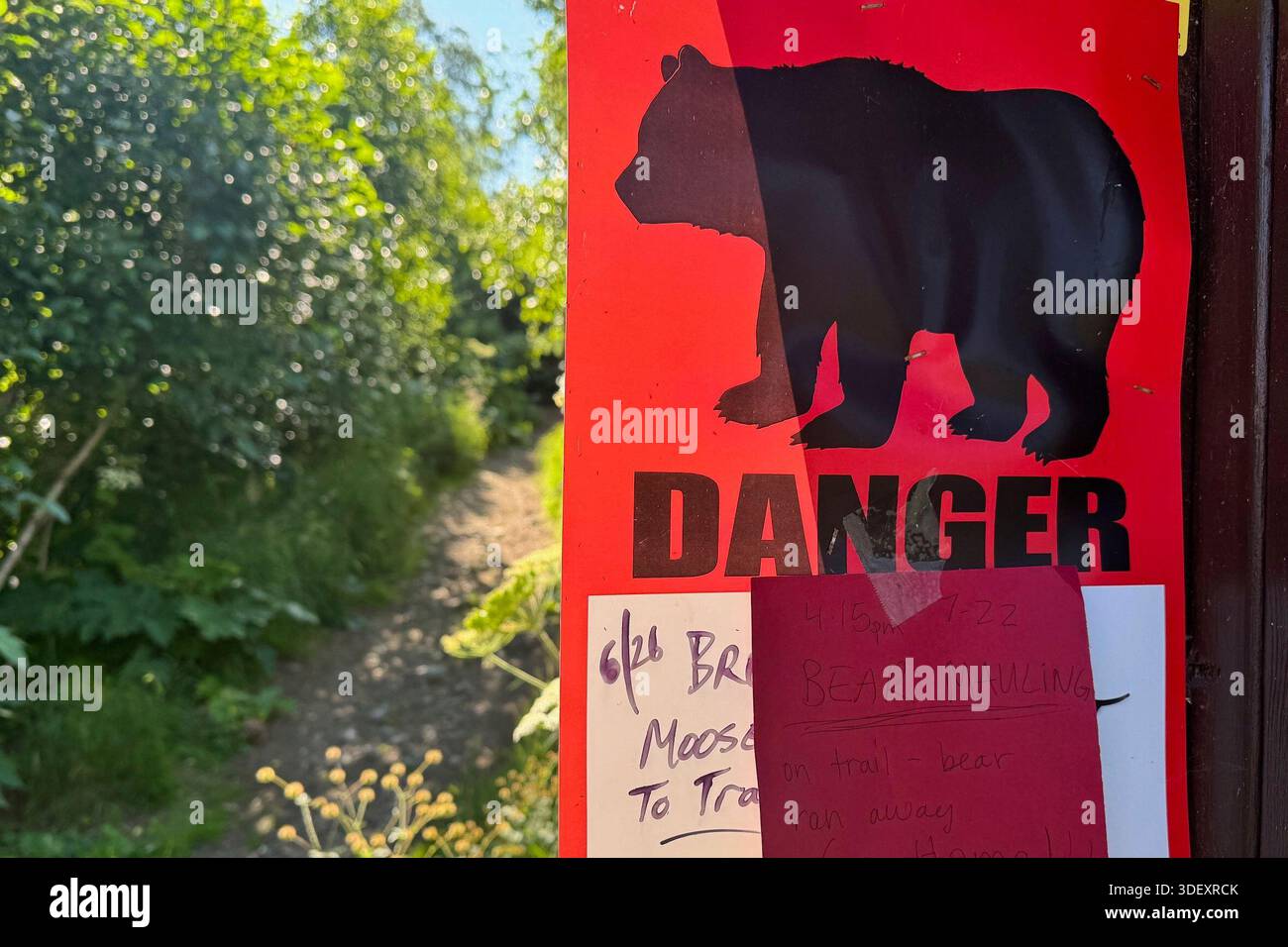 FILE - A bear warning sign is posted at the Basher trailhead in ...
