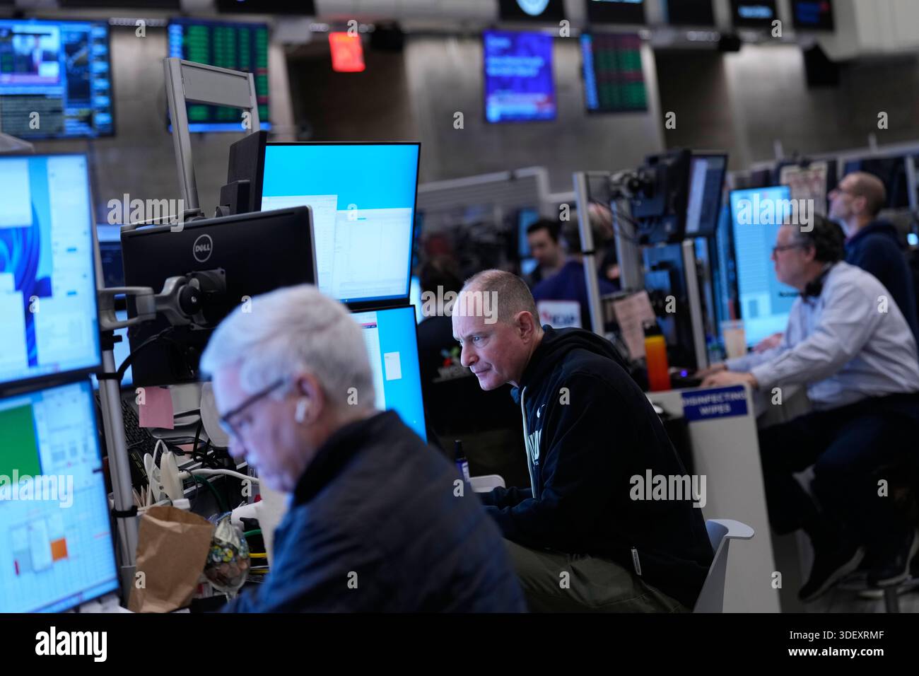 Traders work on the floor at the New York Stock Exchange in New York ...