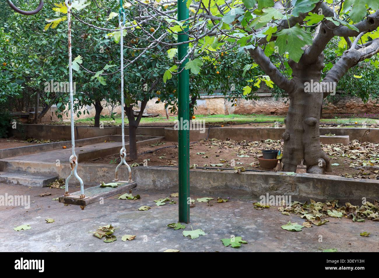 Wide view of a forgotten playground corner with nostalgic charm ...