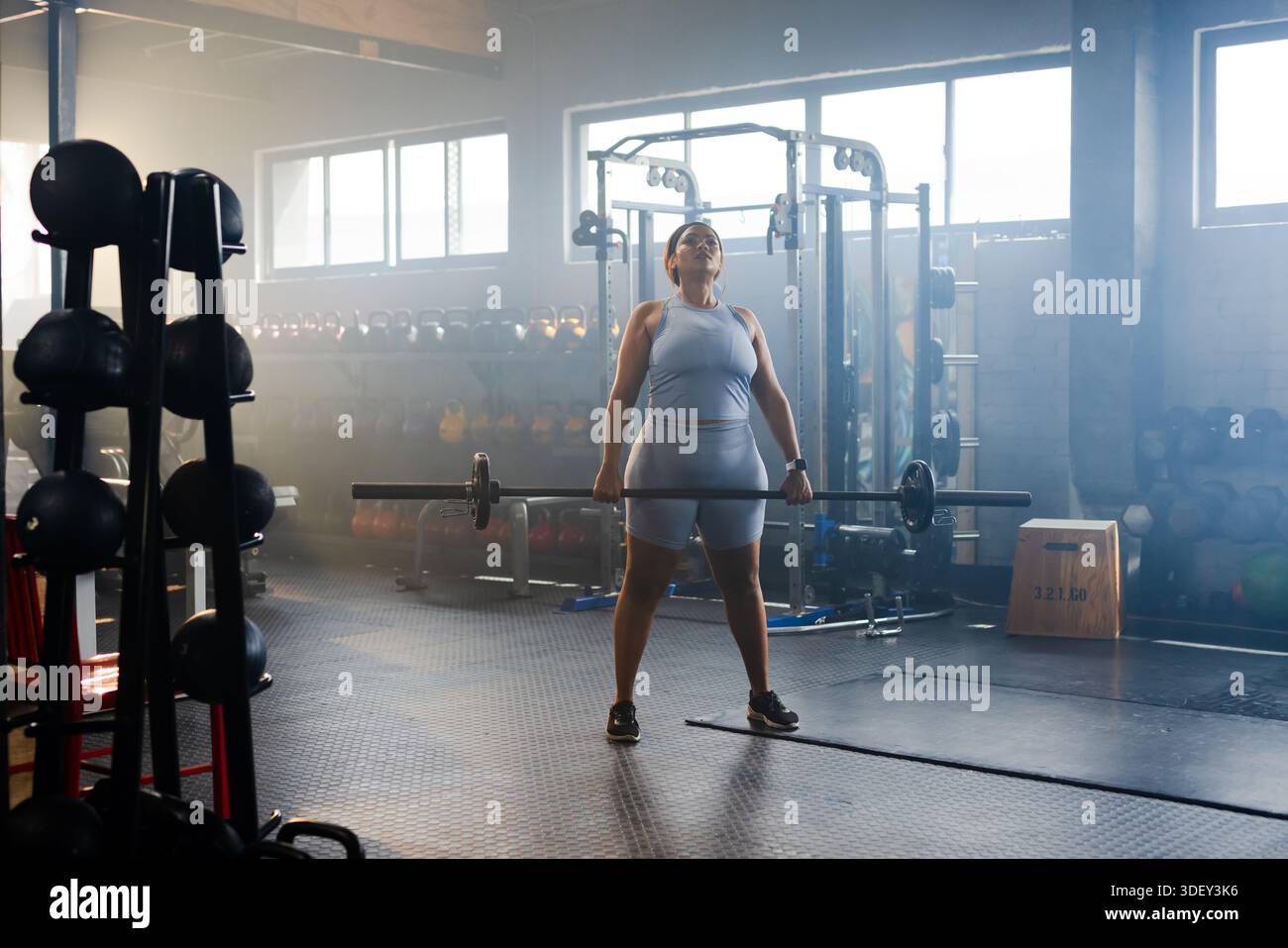 Female performing barbell lift hi-res stock photography and images - Alamy