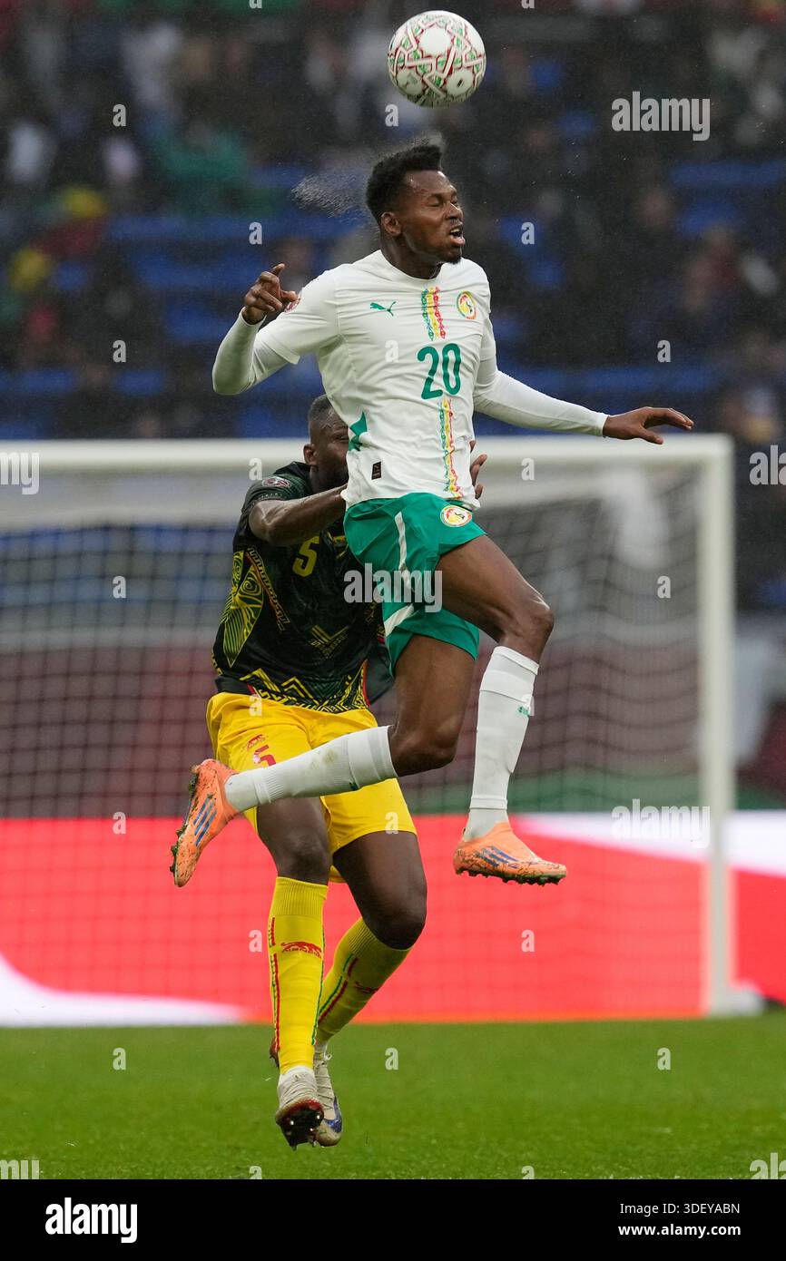 Mali's Abdoulaye Diaby, background, pushes Senegal's Mouhamadou Diallo ...