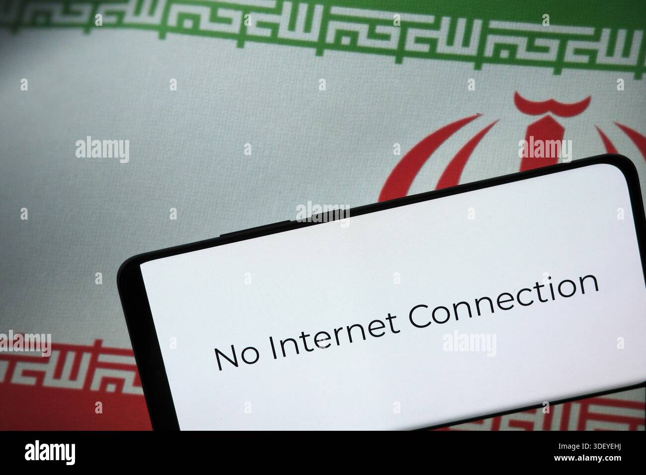 A smartphone displaying a no internet connection message is seen with ...
