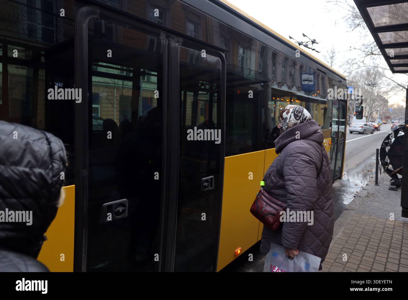 Odessa, Ukraine. 09th Jan, 2026. Passengers wait for the free bus on ...