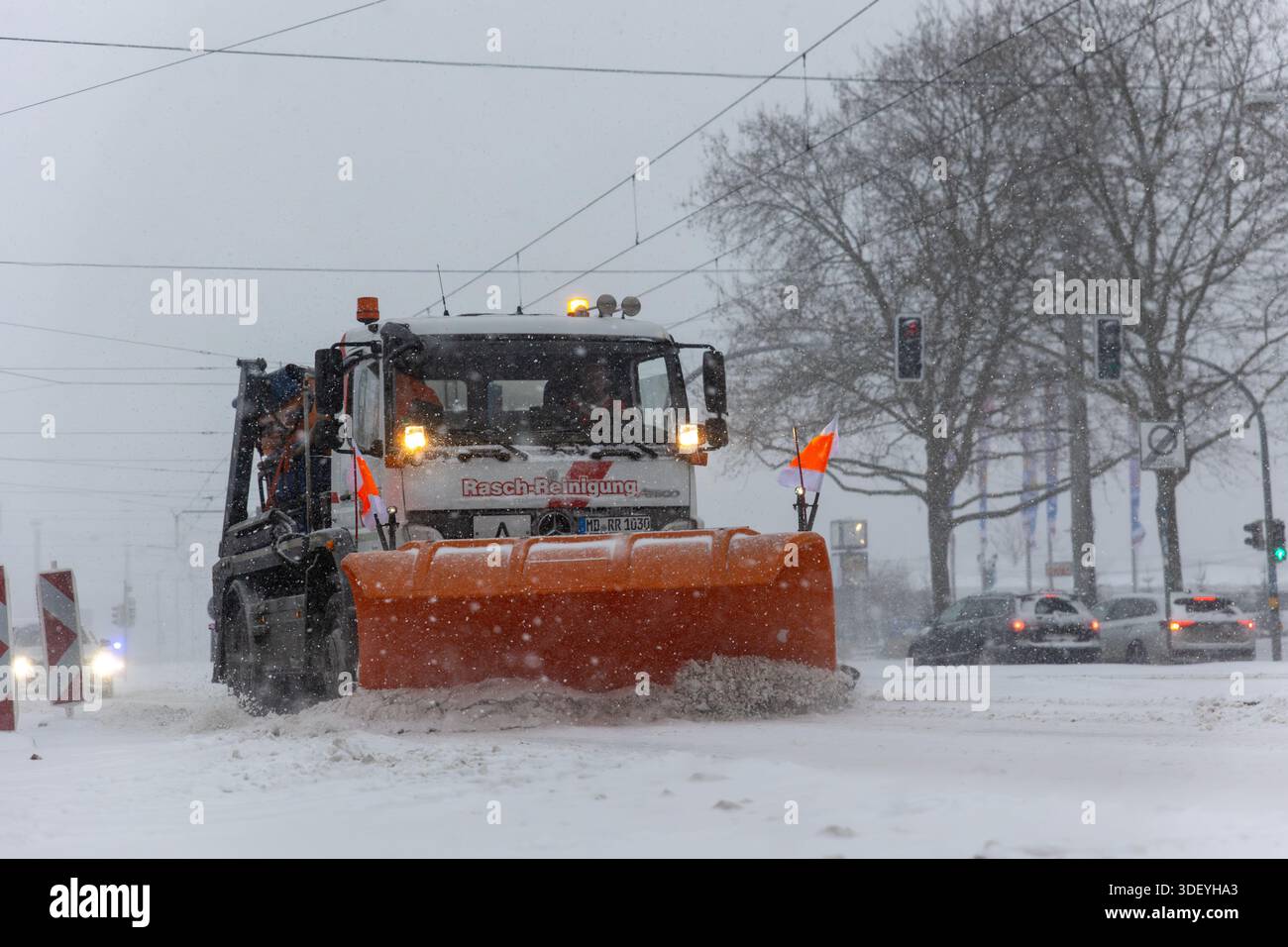 Magdeburg, Germany. 9th Jan 2026. Snowplow works on city street in ...