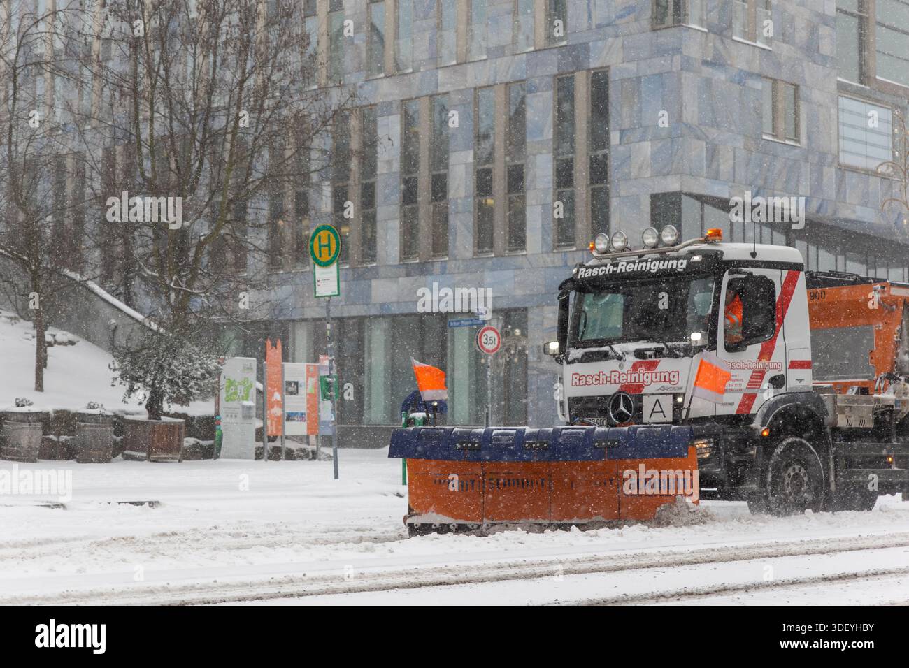 Magdeburg, Germany. 9th Jan 2026. Snowplow clears city street in ...