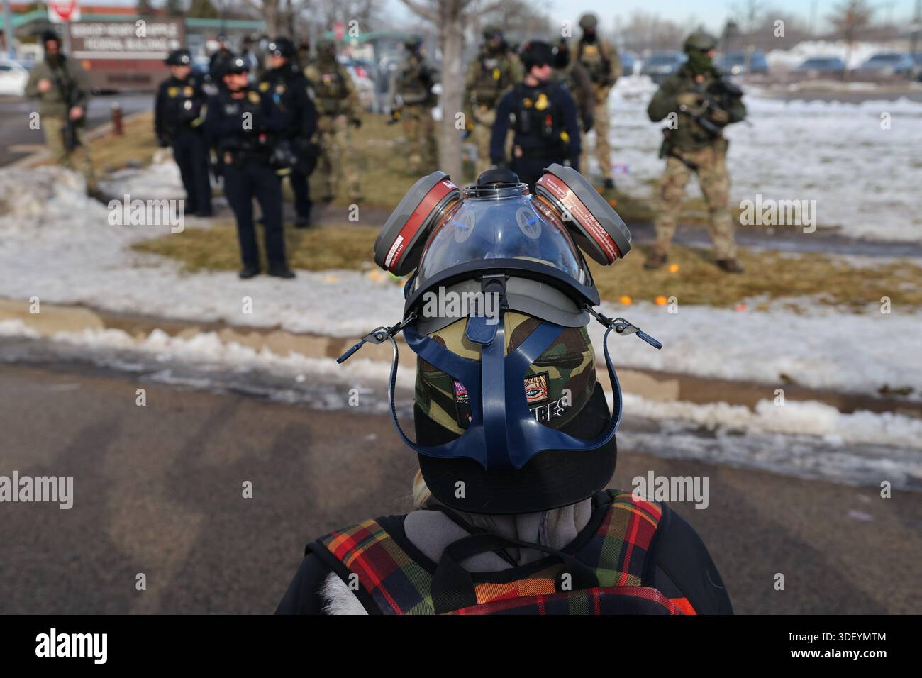 A protesters shouts at Federal agents outside the Bishop Henry Whipple ...