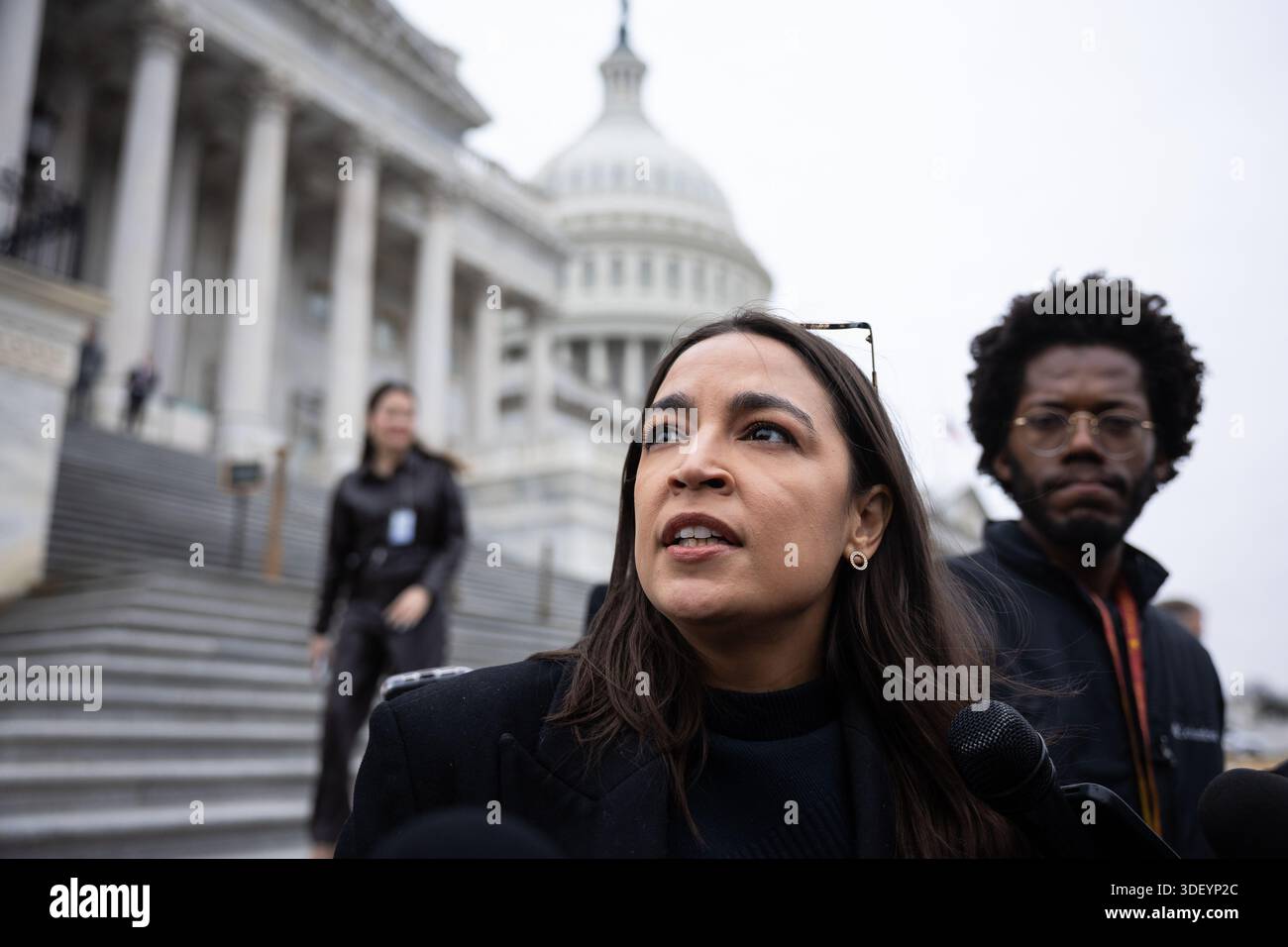Rep. Alexandria Ocasio-Cortez (D-N.Y.) speaks with reporters as she ...
