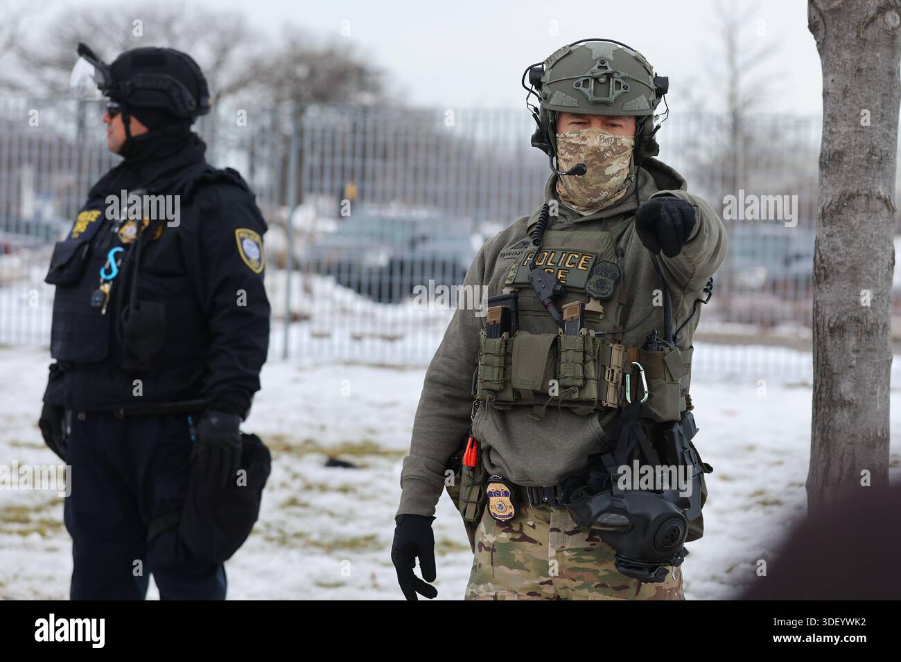 Federal agents and law enforcement stand outside the Bishop Henry ...