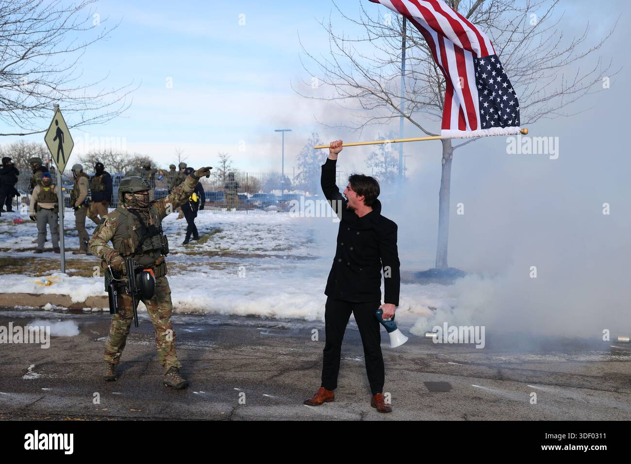 Protesters confront law enforcement outside the Bishop Henry Whipple ...