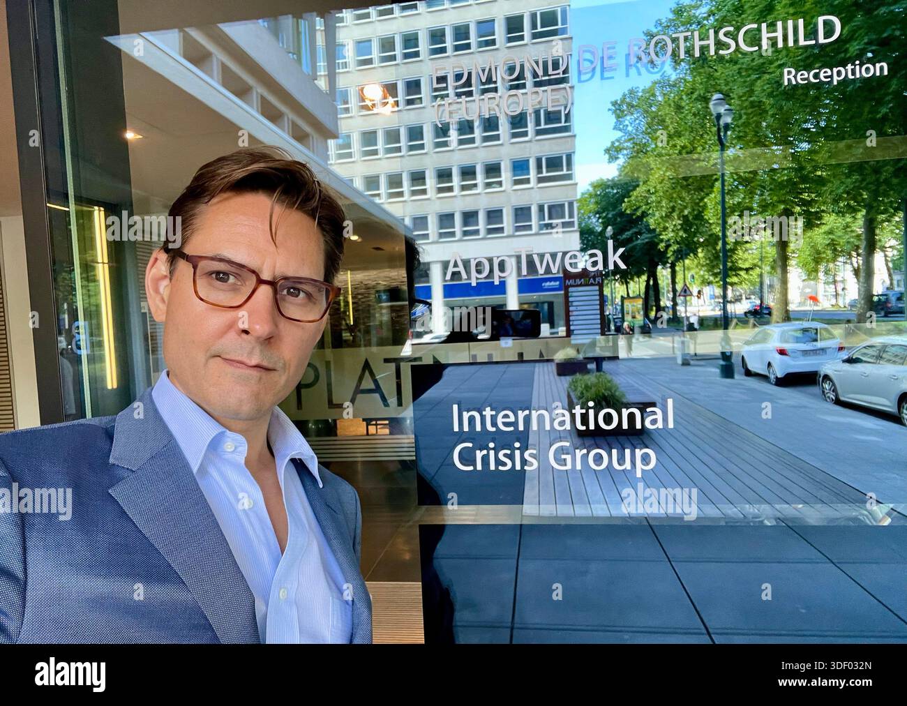 Michael Kovrig is seen outside the headquarters of the International ...