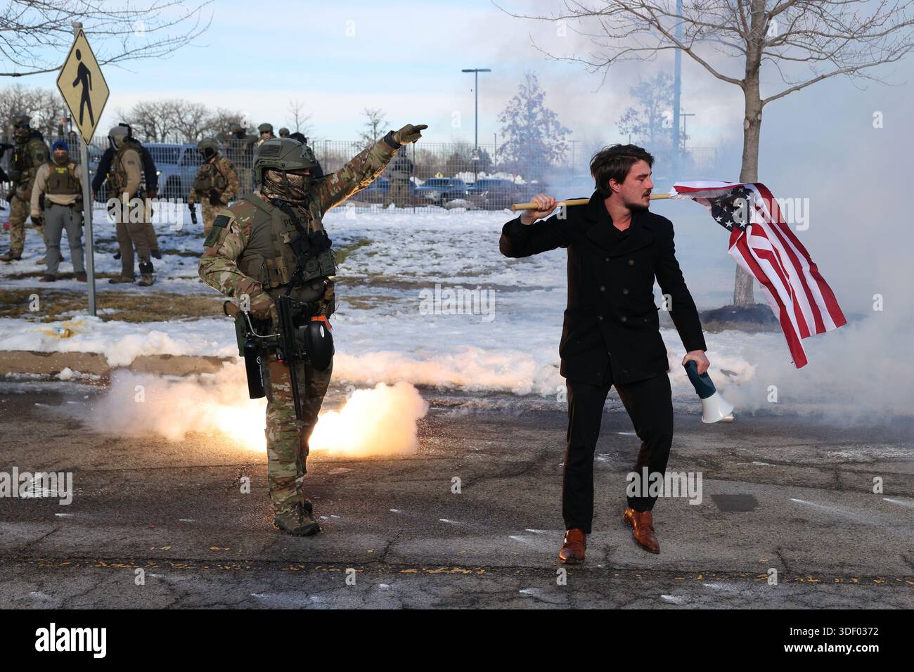 Protesters confront law enforcement outside the Bishop Henry Whipple ...
