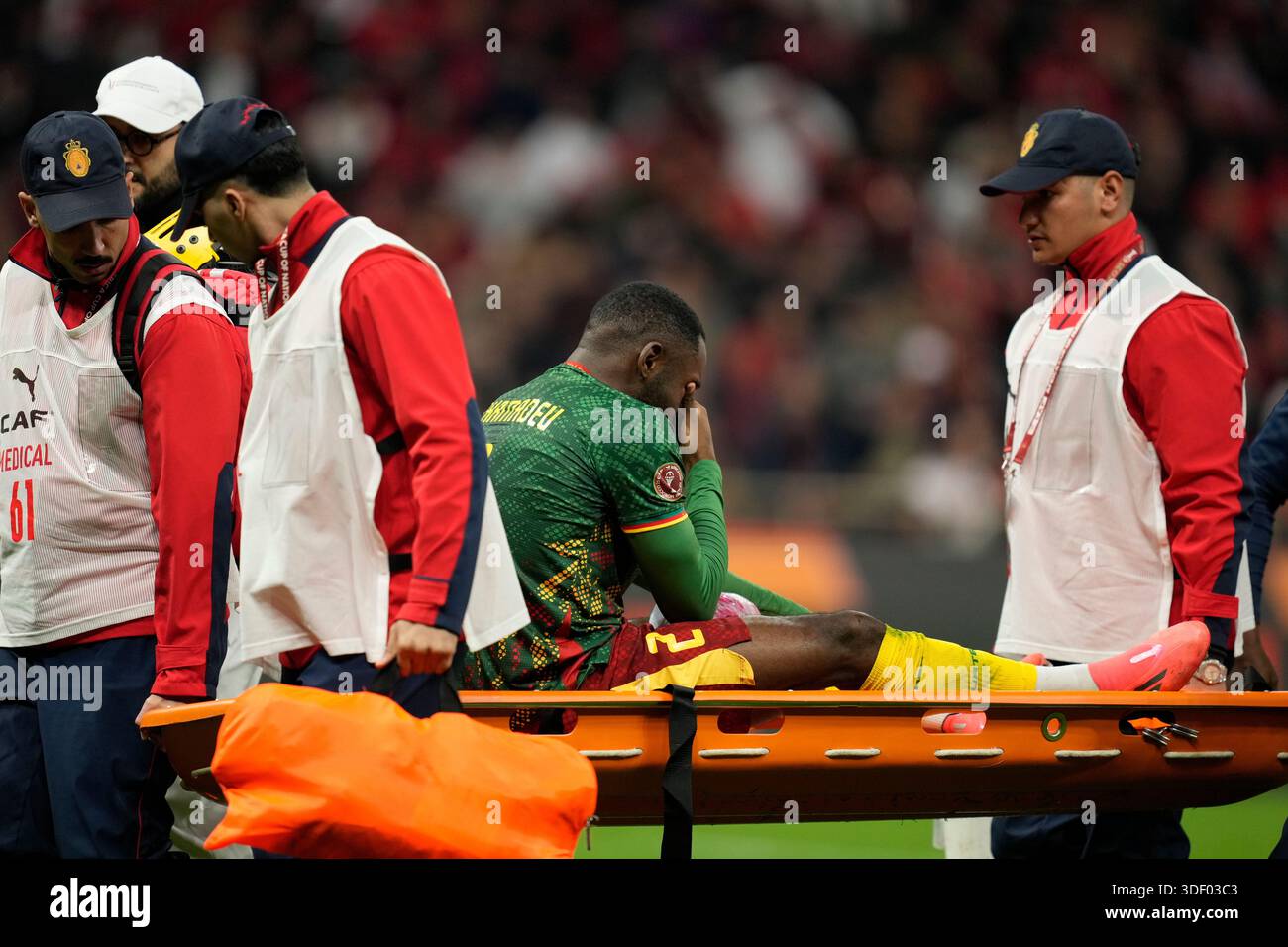 Injured Cameroon's Junior Tchamadeu is carried on stretcher during the ...