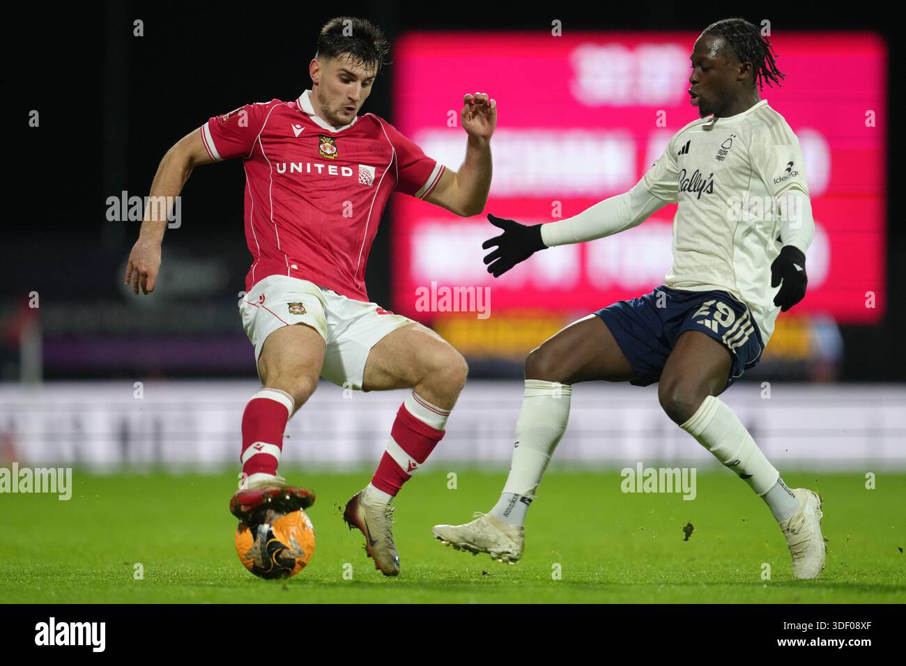 Wrexham's Ryan Longman, left, and Nottingham Forest's Dilane Bakwa ...
