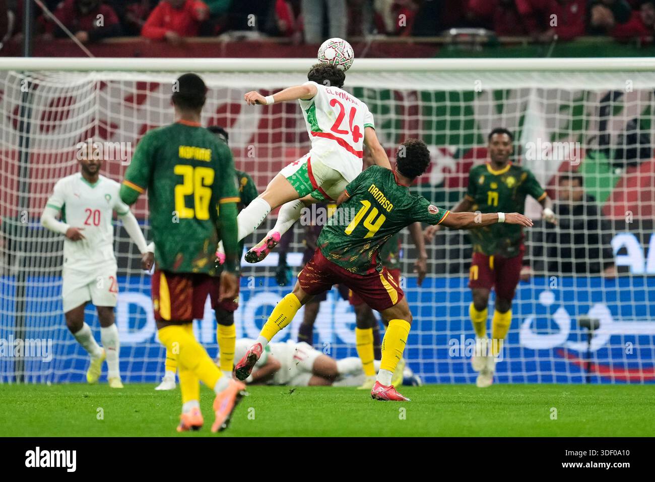 Morocco's Neil Yoni El Aynaoui, center, heads the ball during the ...